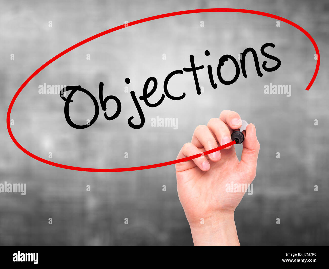Man Hand writing Objections with black marker on visual screen ...