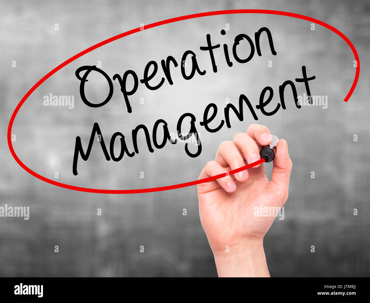 Man Hand writing Operation Management with black marker on visual ...