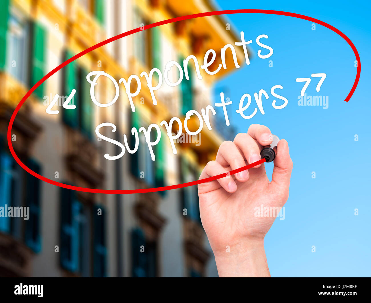 Man Hand writing Opponents - Supporters with black marker on visual ...