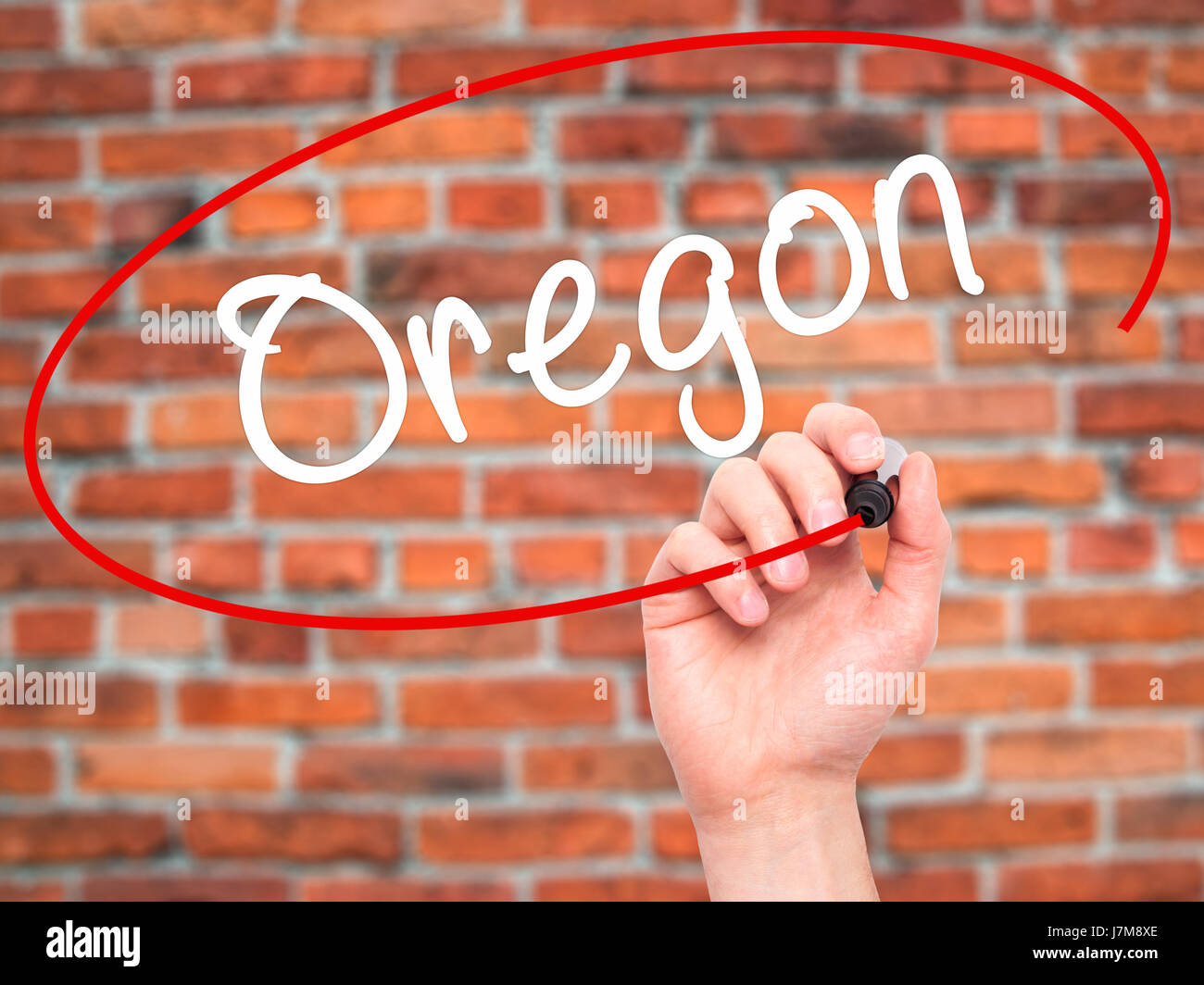 Man Hand writing Oregon with black marker on visual screen. Isolated on ...