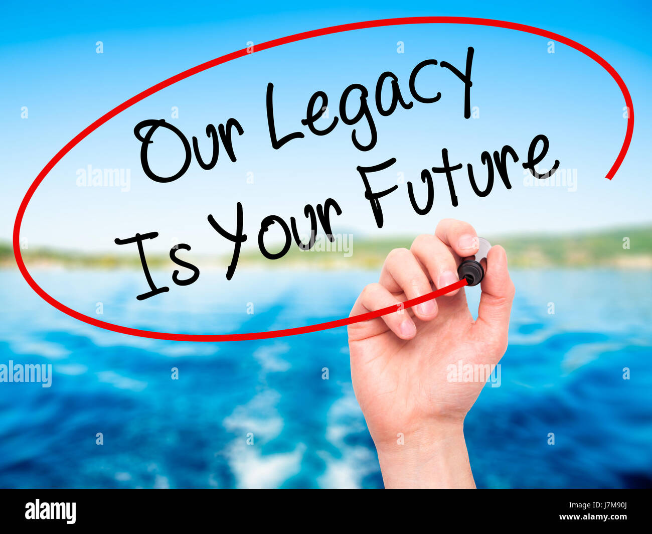 Man Hand writing Our Legacy Is Your Future with black marker on visual ...