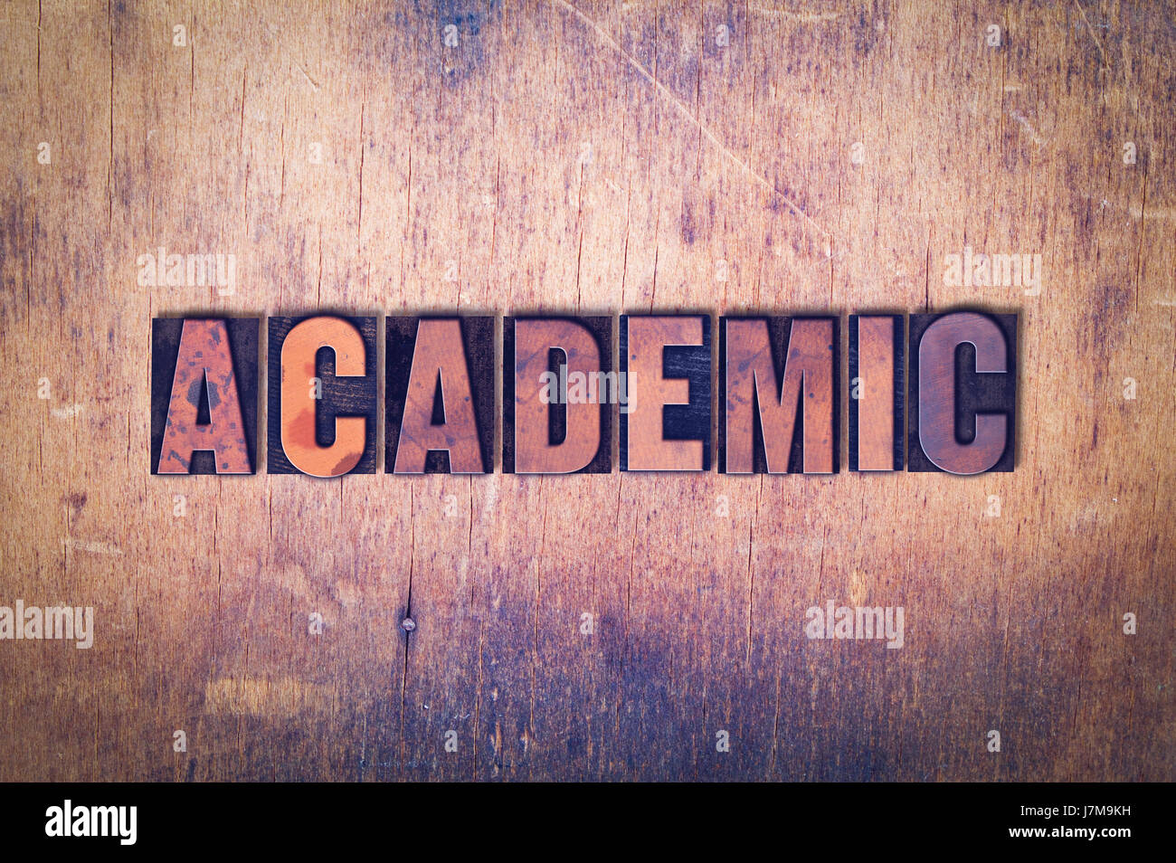 The word Academic concept and theme written in vintage wooden ...