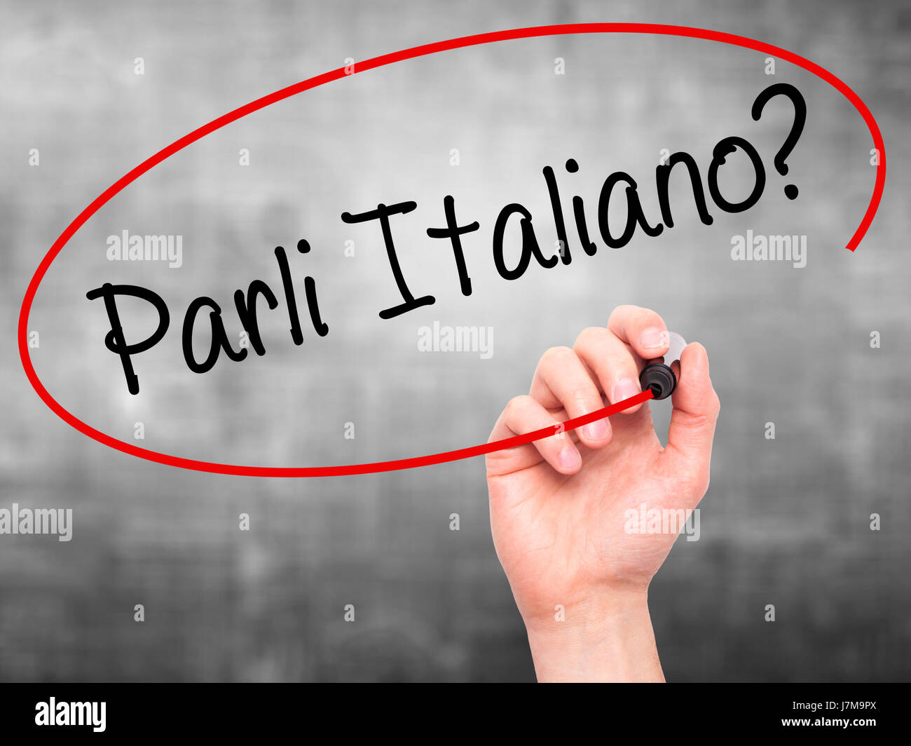 Man Hand writing Parli Italiano? with black marker on visual screen ...