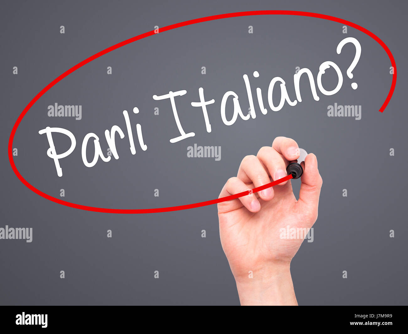 Man Hand writing Parli Italiano? with black marker on visual screen ...