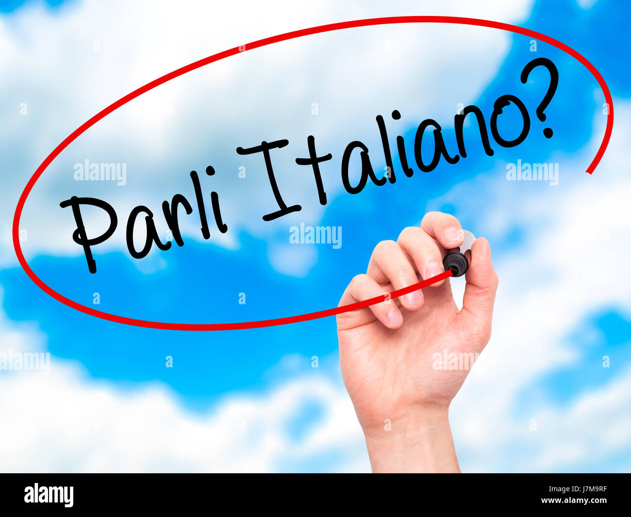 Man Hand writing Parli Italiano? with black marker on visual screen ...