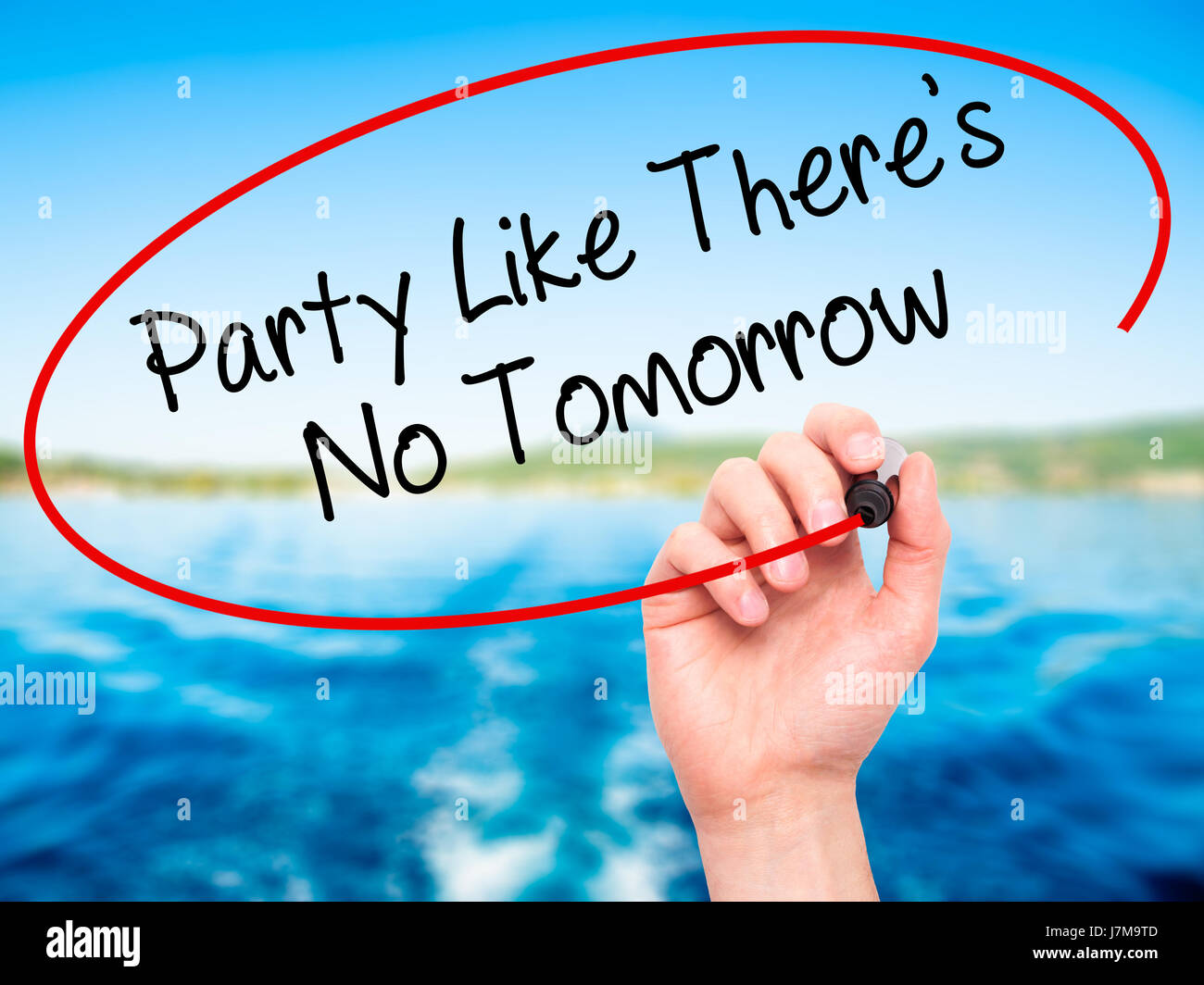 Man Hand writing Party Like There's No Tomorrow with black marker on ...