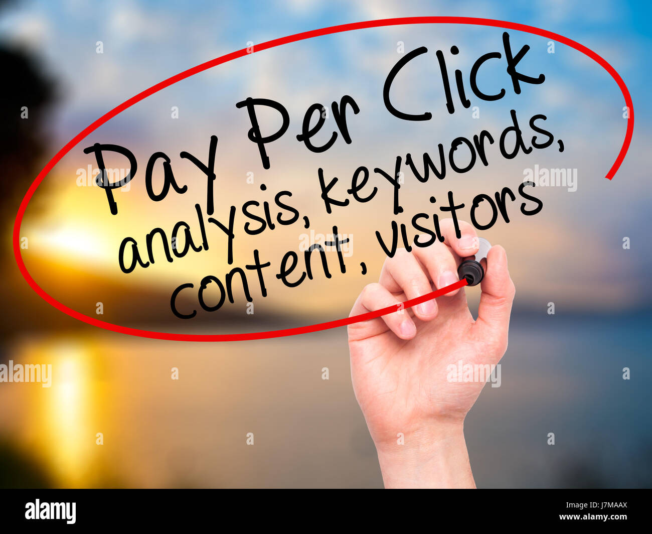 Man Hand writing Pay Per Click analysis, keywords, content, visitors ...