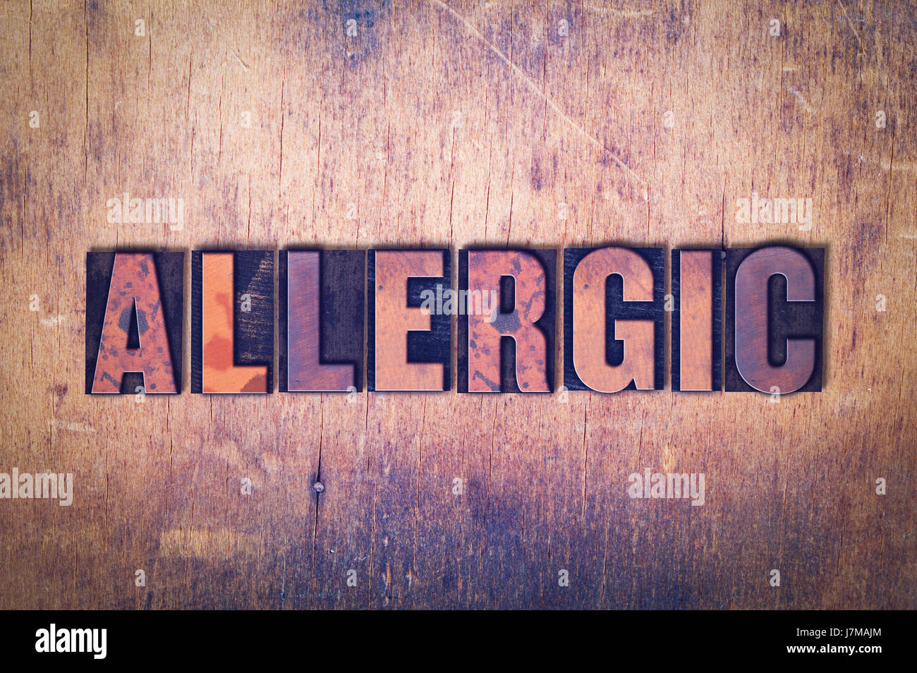 The word Allergic concept and theme written in vintage wooden ...