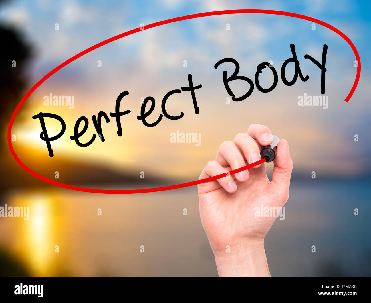 Man Hand writing Perfect Body with black marker on visual screen ...