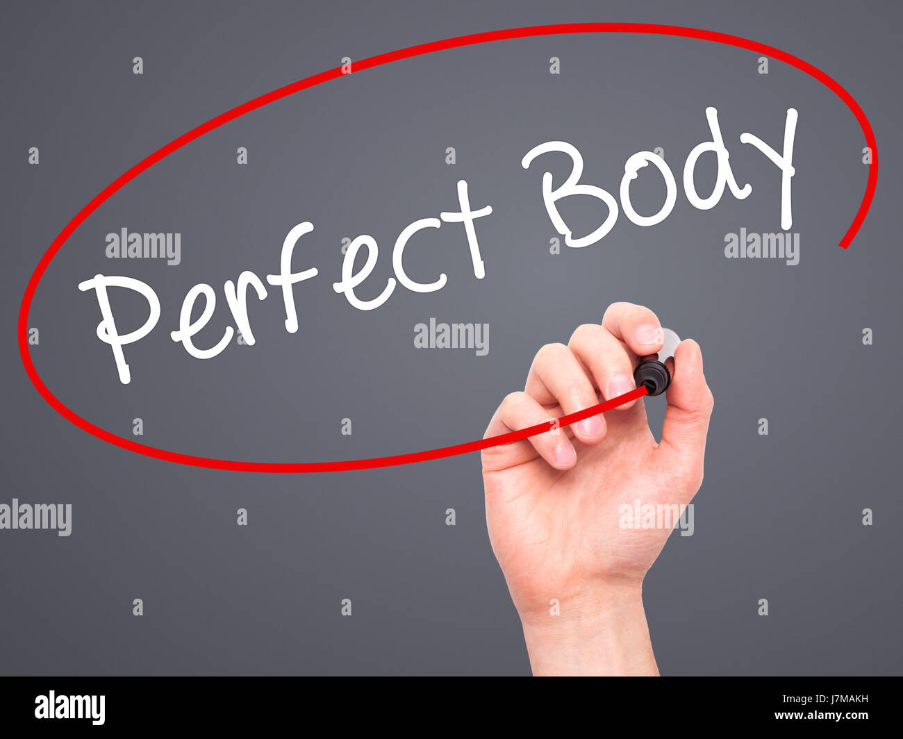 Man Hand writing Perfect Body with black marker on visual screen ...