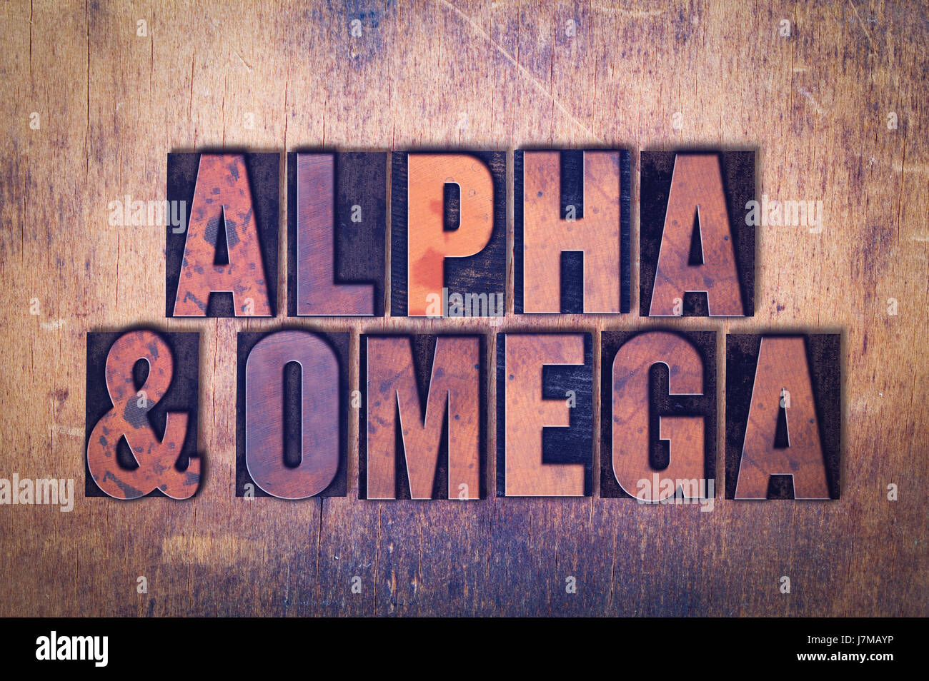 The words Alpha and Omega concept and theme written in vintage wooden ...