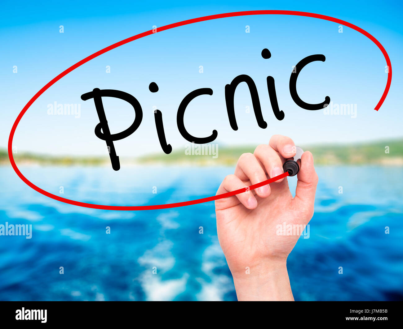 Man Hand writing Picnic with black marker on visual screen. Isolated on ...