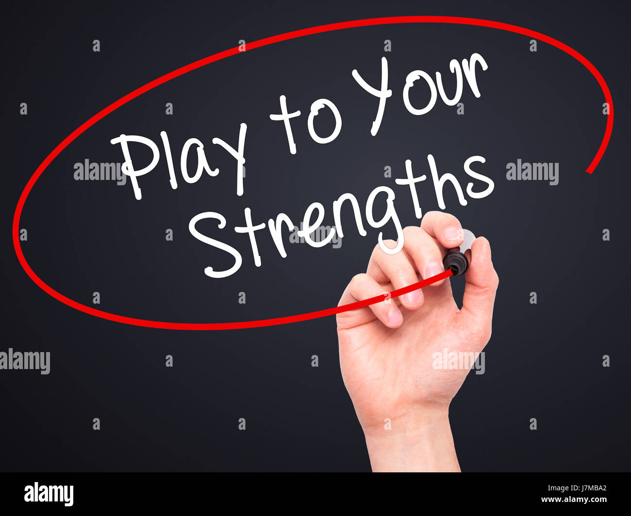 Man Hand writing Play to Your Strengths with black marker on visual ...