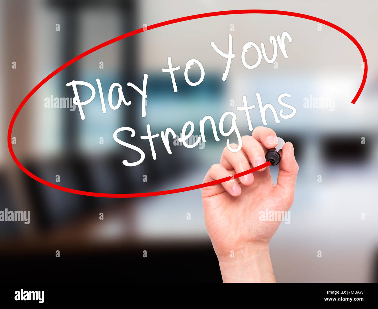 Man Hand writing Play to Your Strengths with black marker on visual ...