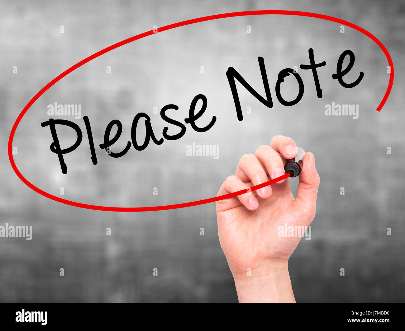 Man Hand writing Please Note with black marker on visual screen ...