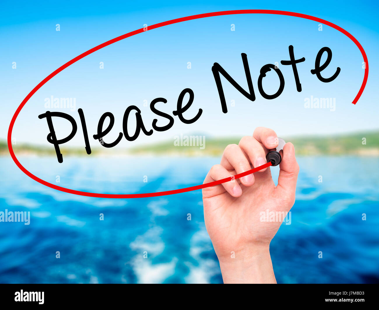 Man Hand writing Please Note with black marker on visual screen ...