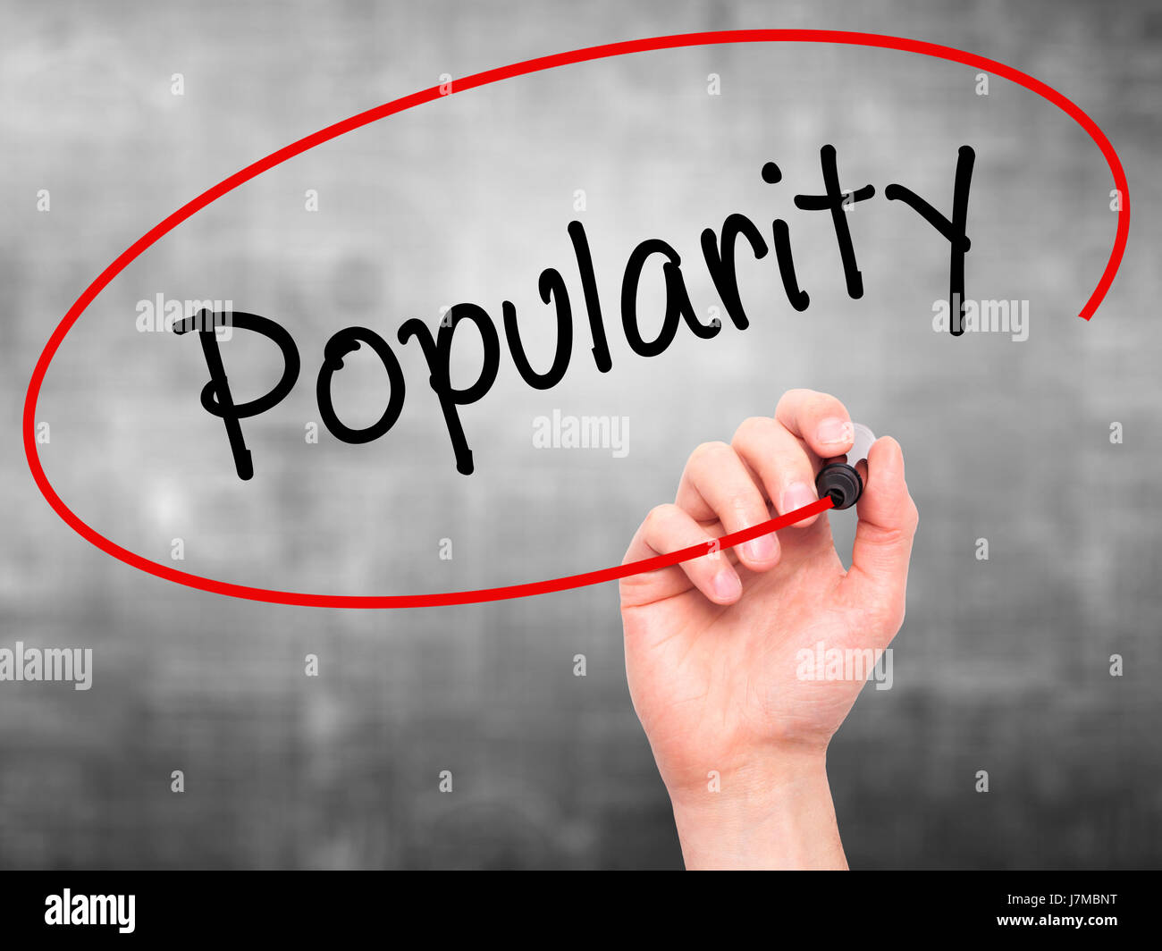 Man Hand writing Popularity with black marker on visual screen ...