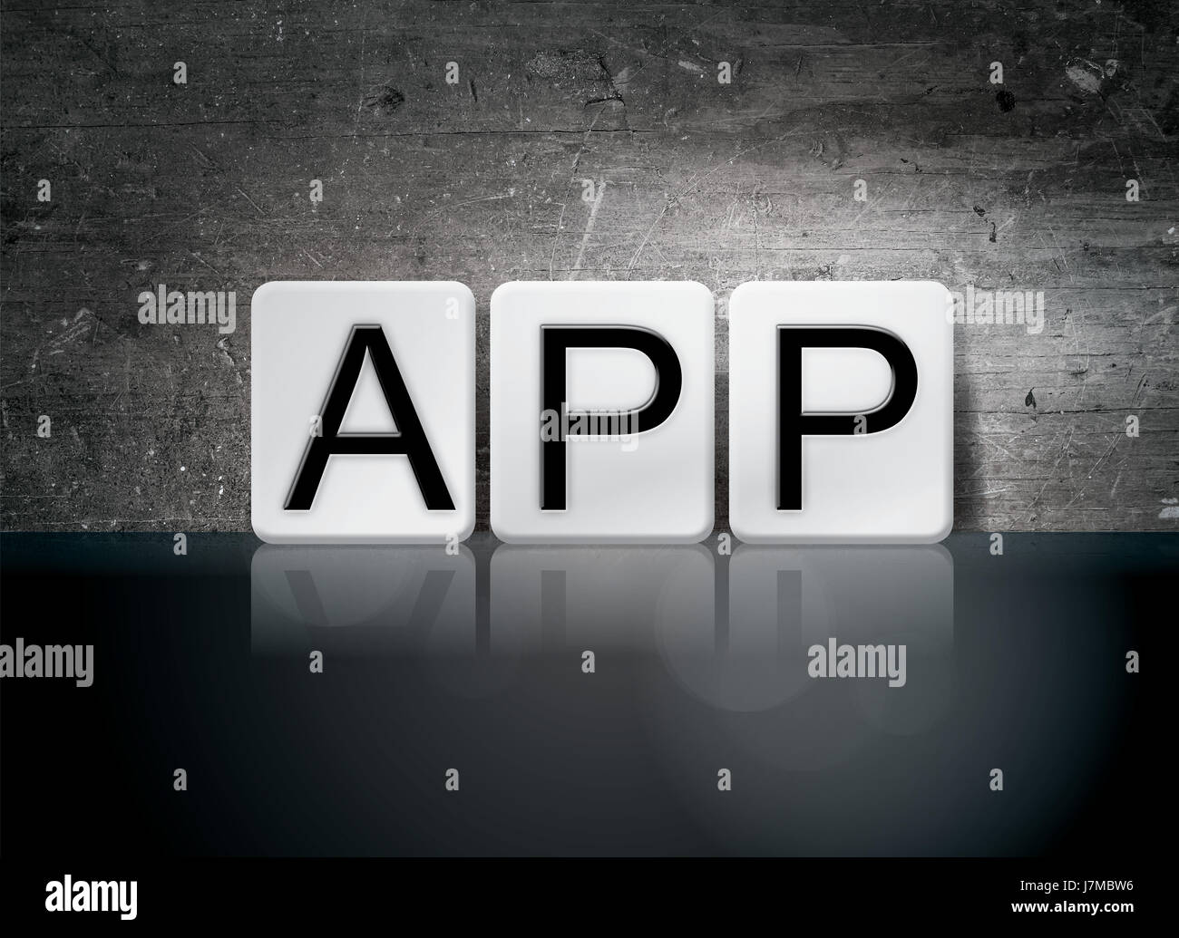 The word App concept and theme written in white tiles on a dark ...
