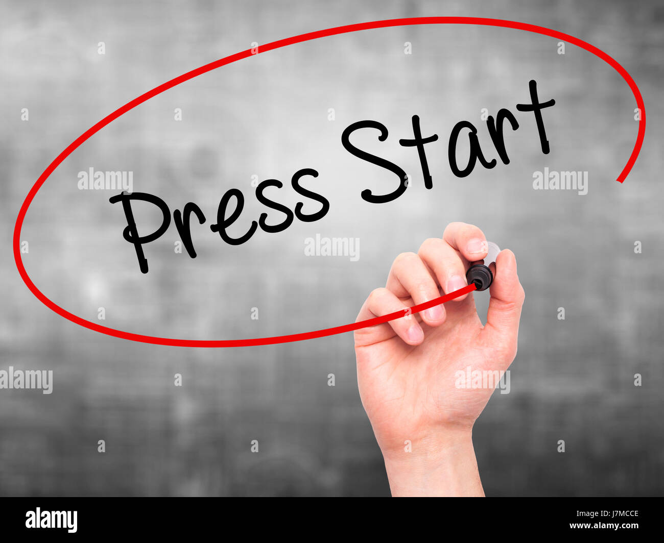 Man Hand writing Press Start with black marker on visual screen ...