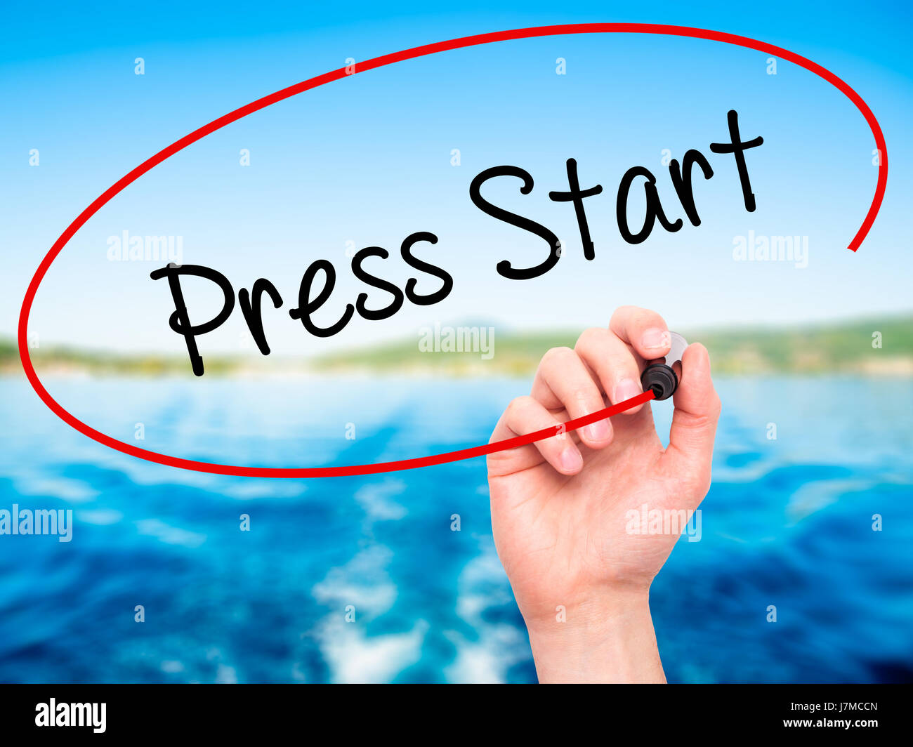 Man Hand writing Press Start with black marker on visual screen ...