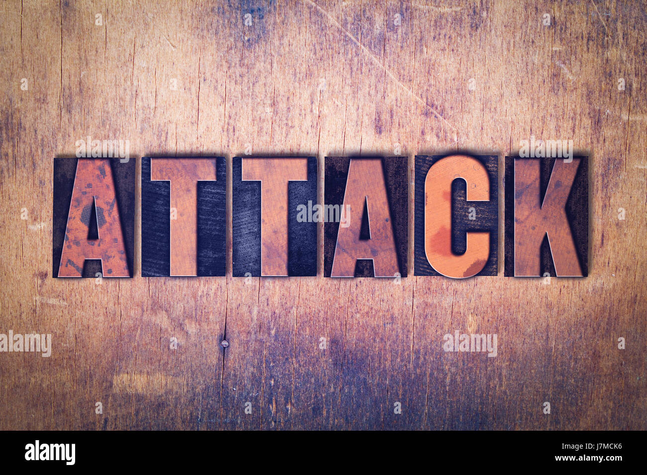 The word Attack concept and theme written in vintage wooden letterpress ...