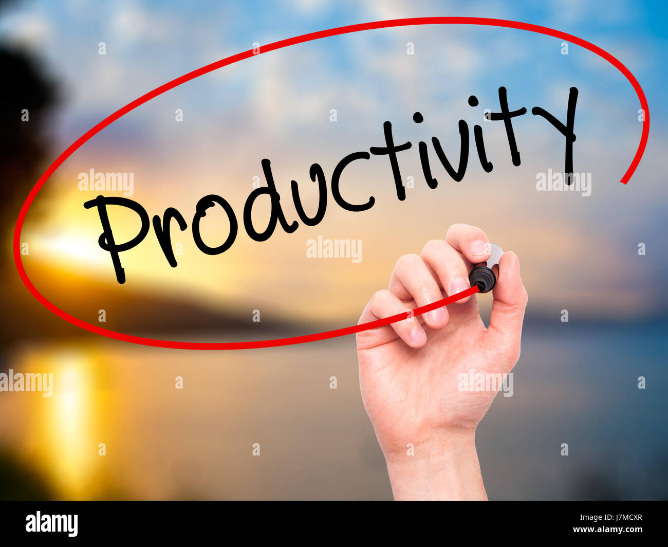 Man Hand writing Productivity with black marker on visual screen ...