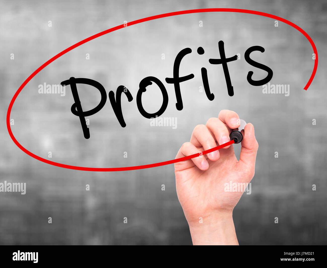 Man Hand writing Profits with black marker on visual screen. Isolated ...