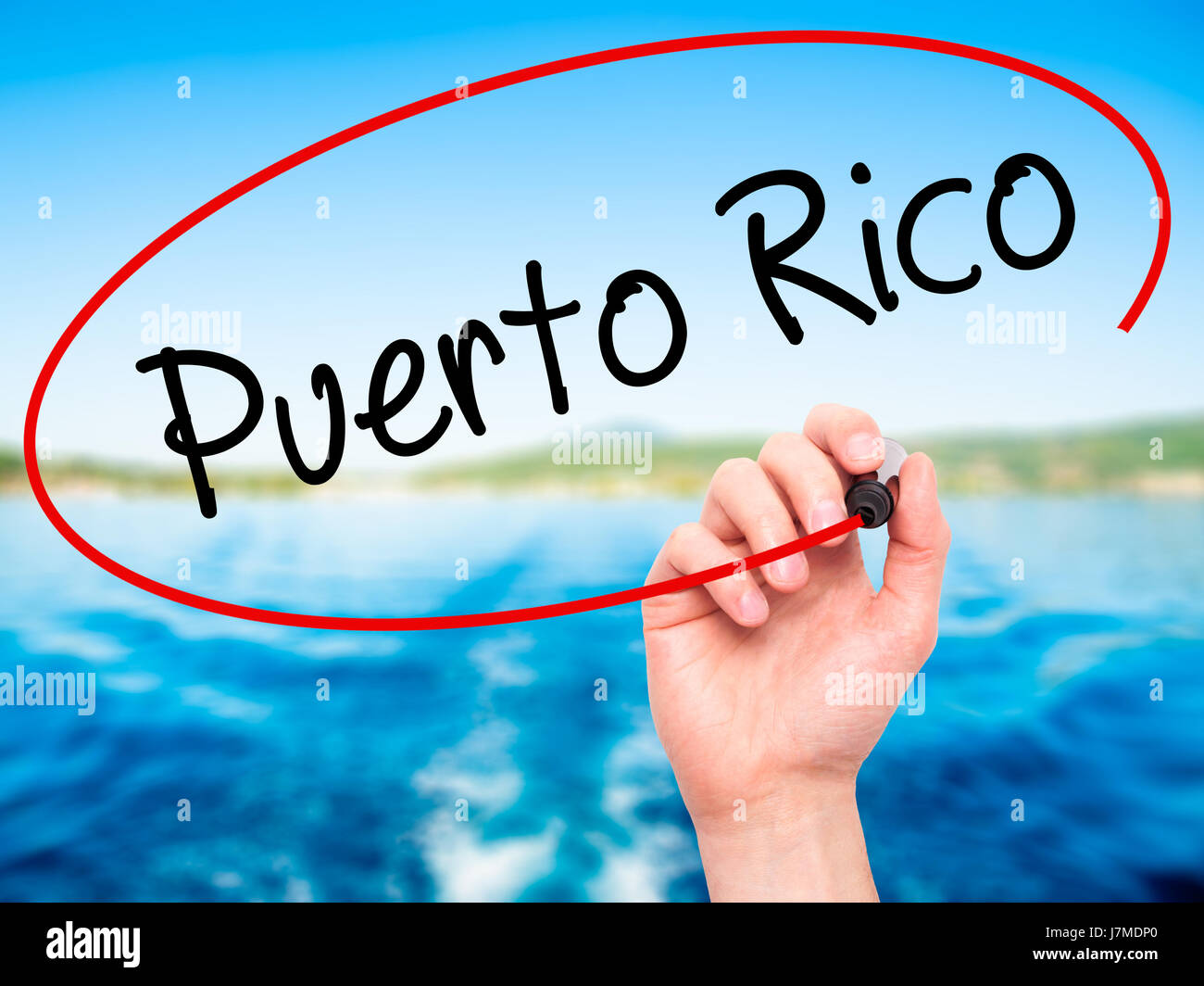 Man Hand writing Puerto Rico with black marker on visual screen ...