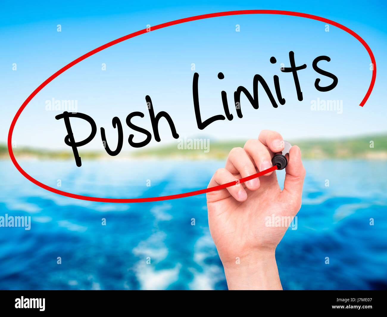 Man Hand writing Push Limits with black marker on visual screen ...