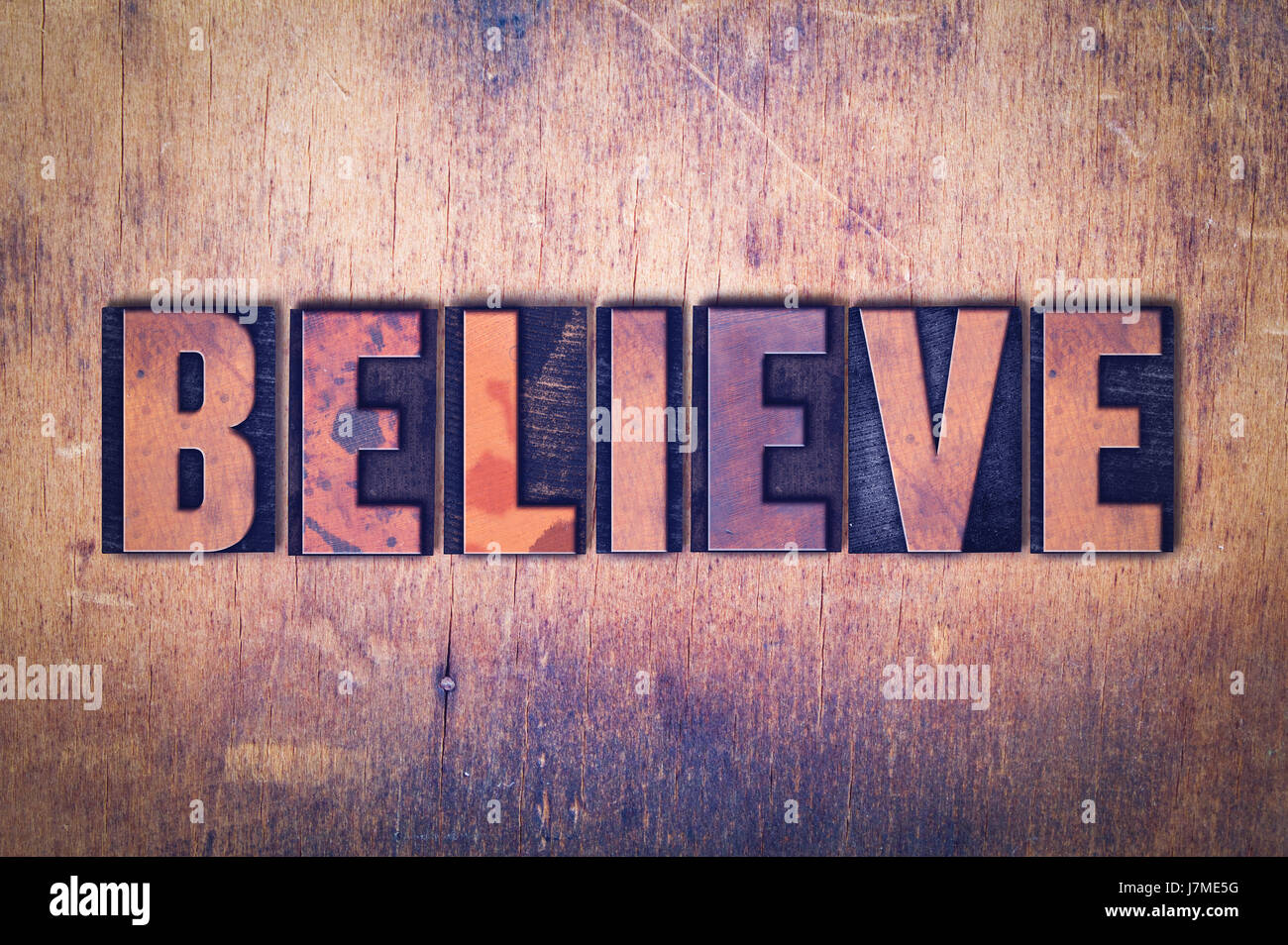 The word Believe concept and theme written in vintage wooden ...
