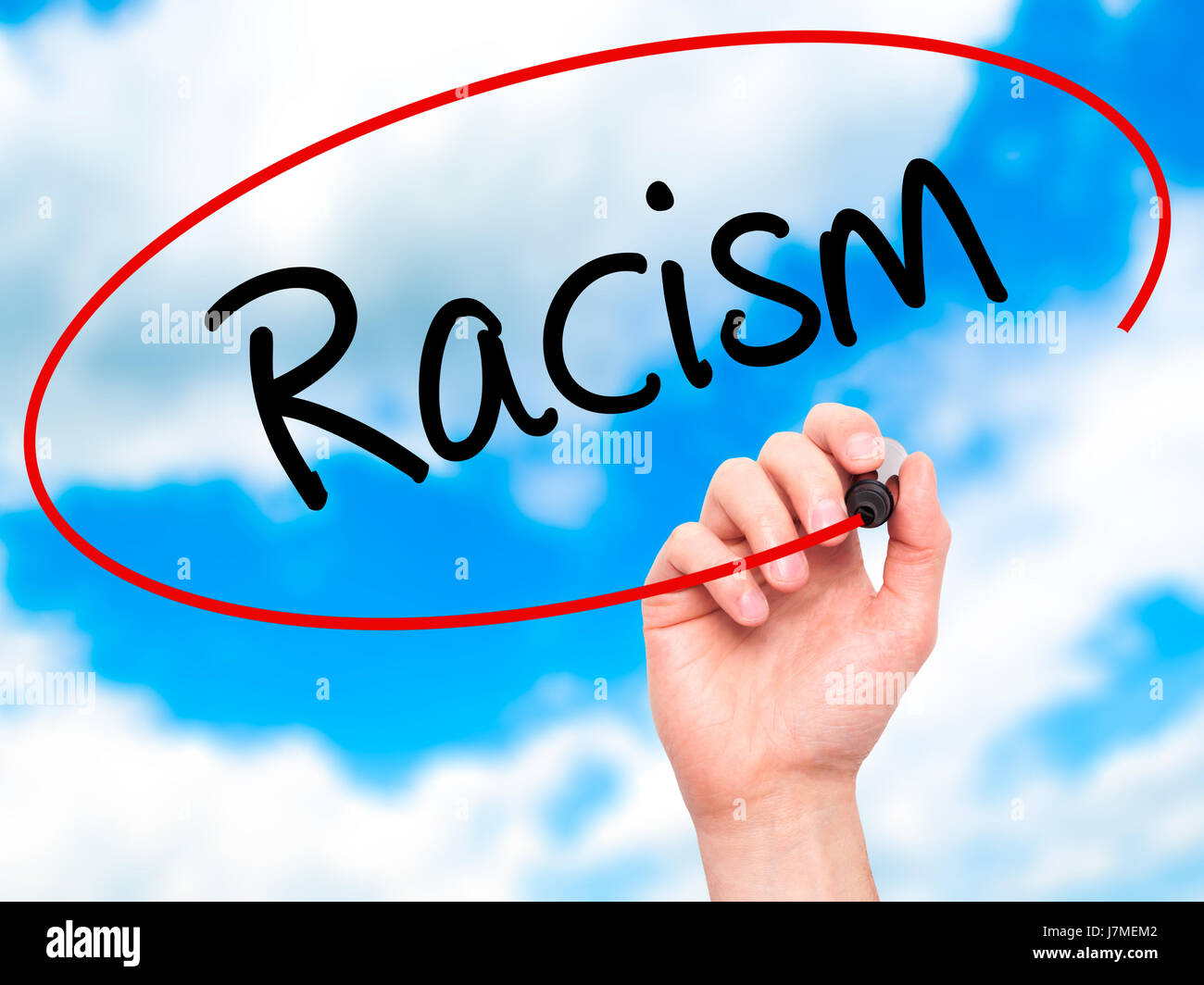 Man Hand writing Racism with black marker on visual screen. Isolated on ...