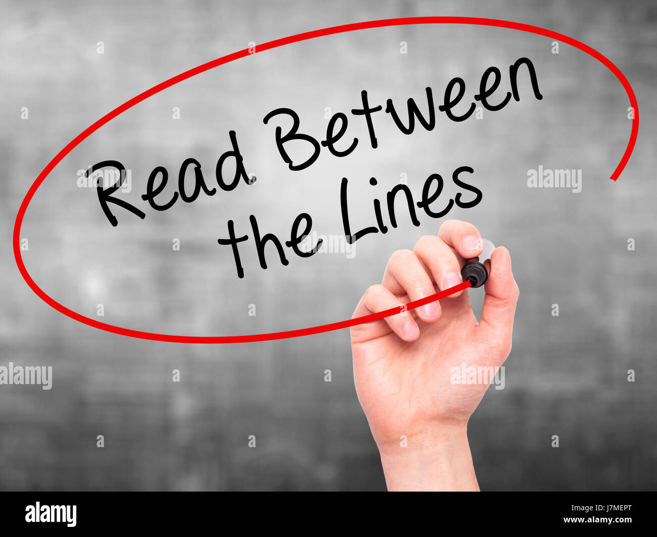 Man Hand writing Read Between the Lines with black marker on visual ...