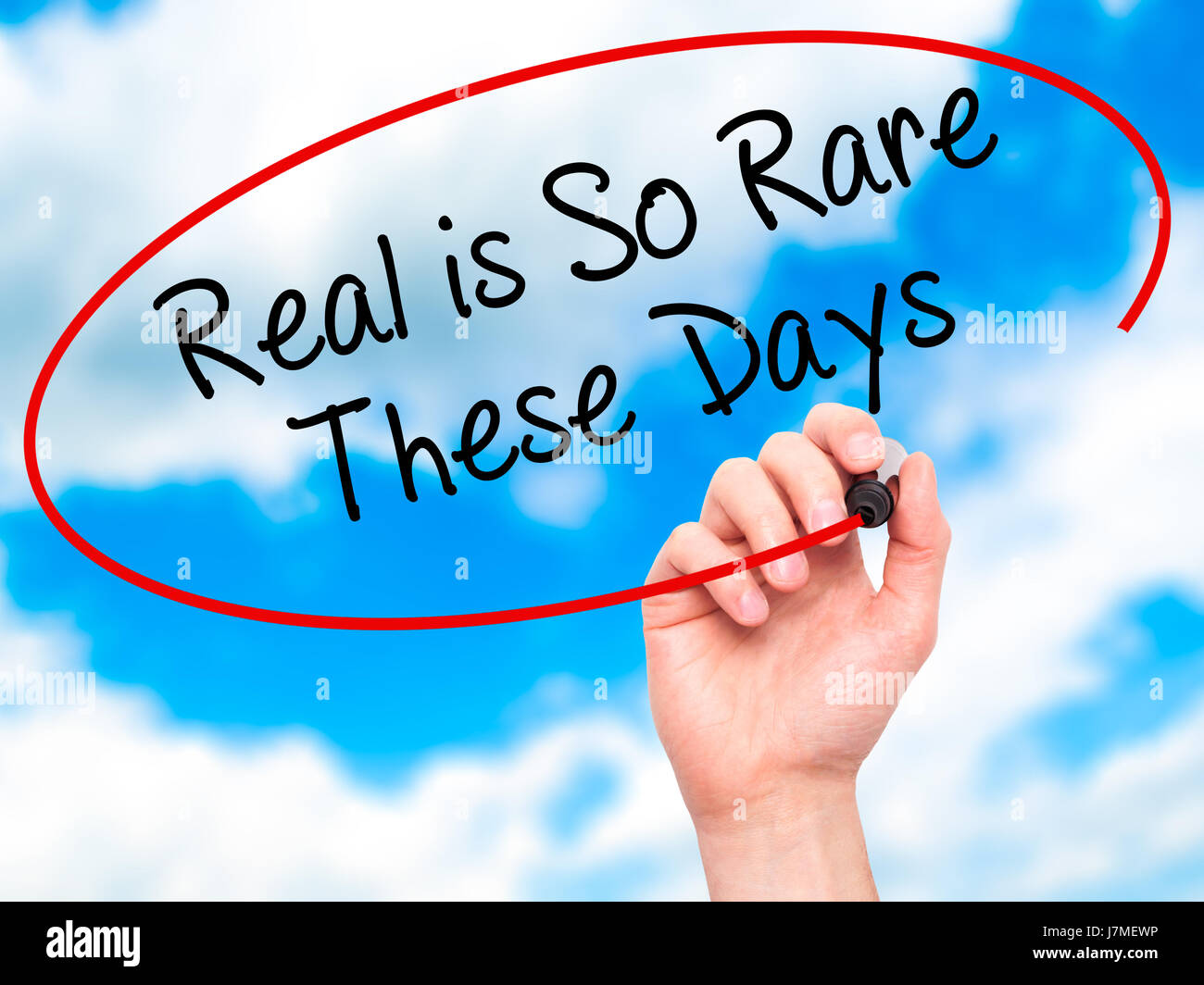 Man Hand writing Real is So Rare These Days with black marker on visual ...