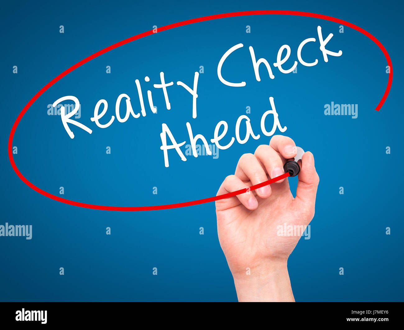 Man Hand writing Reality Check Ahead with black marker on visual screen ...