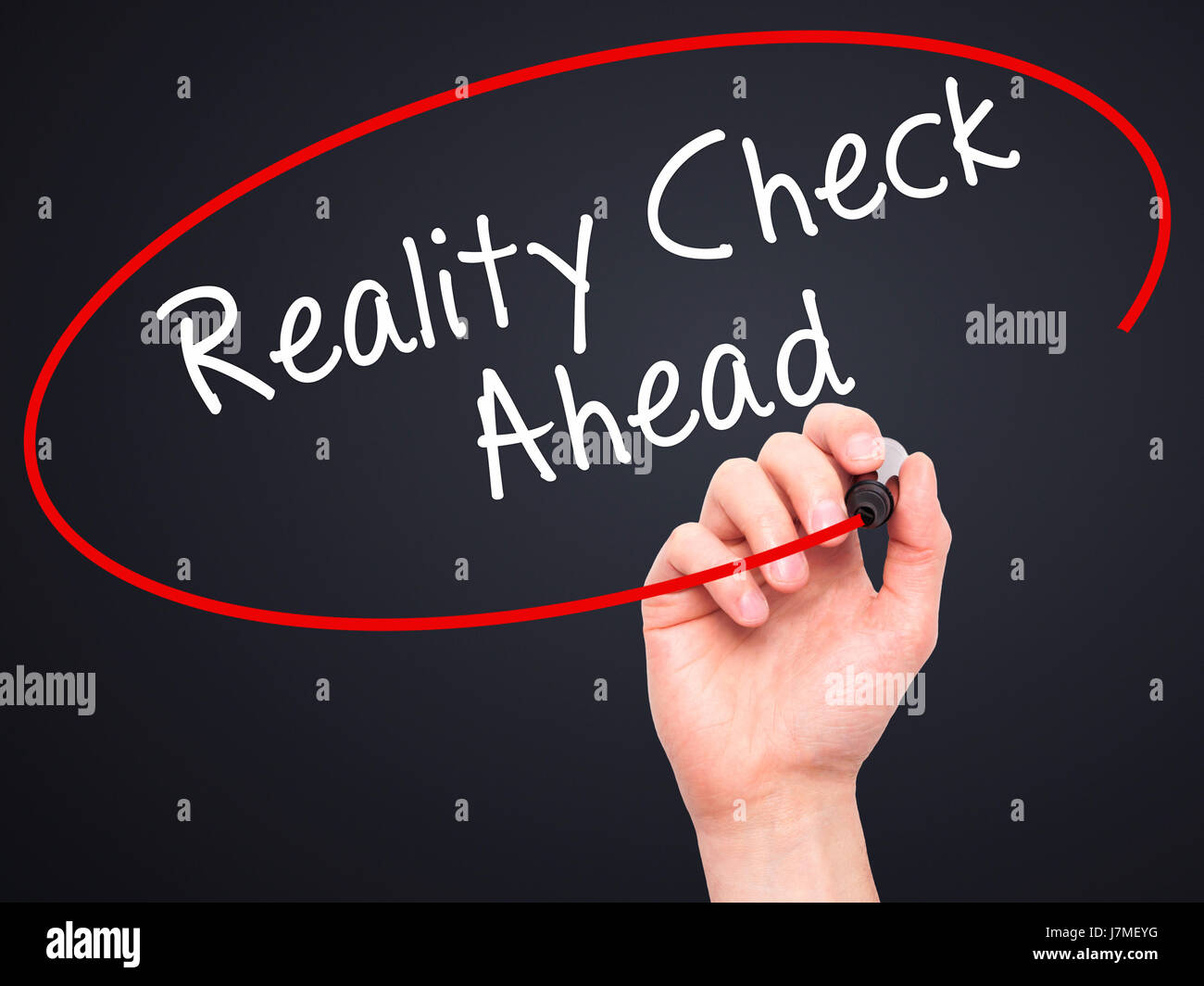 Man Hand writing Reality Check Ahead with black marker on visual screen ...