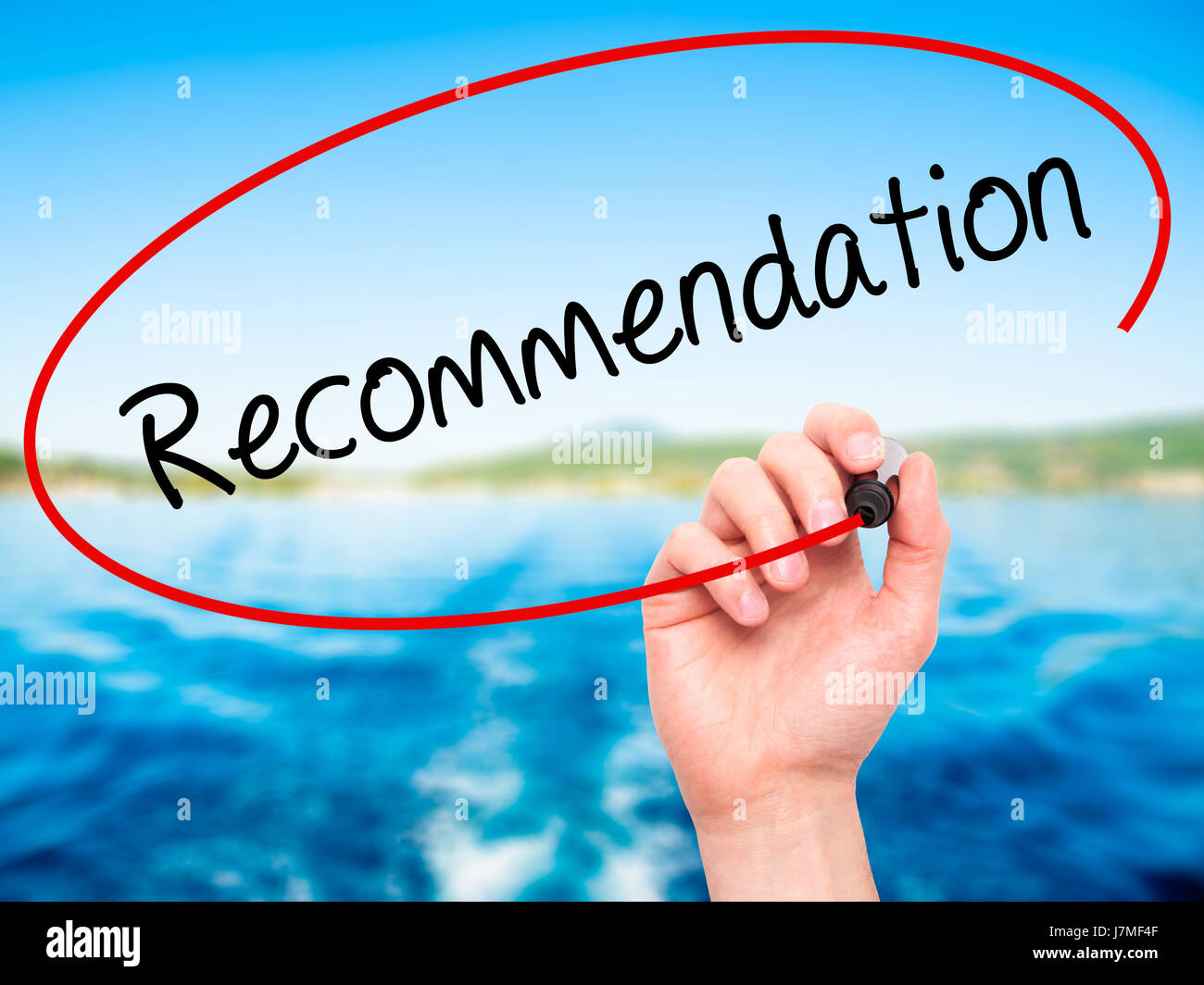 Man Hand writing Recommendation with black marker on visual screen ...