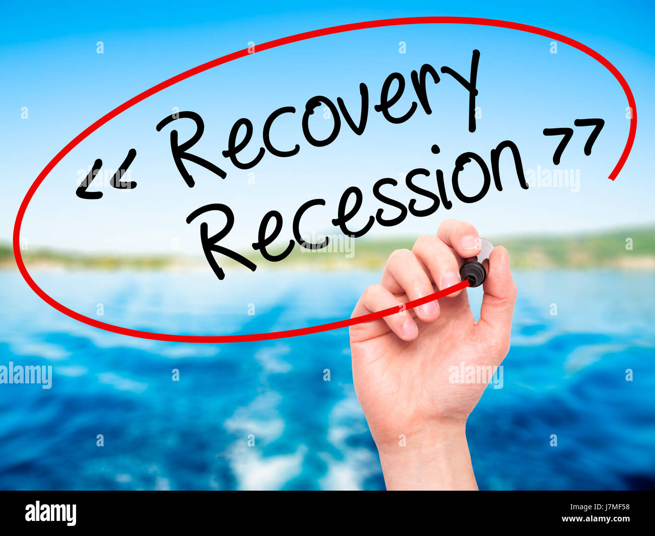Man Hand writing Recovery - Recession with black marker on visual ...