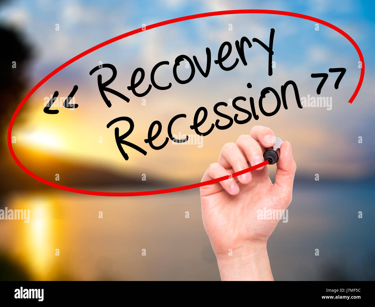 Man Hand writing Recovery - Recession with black marker on visual ...