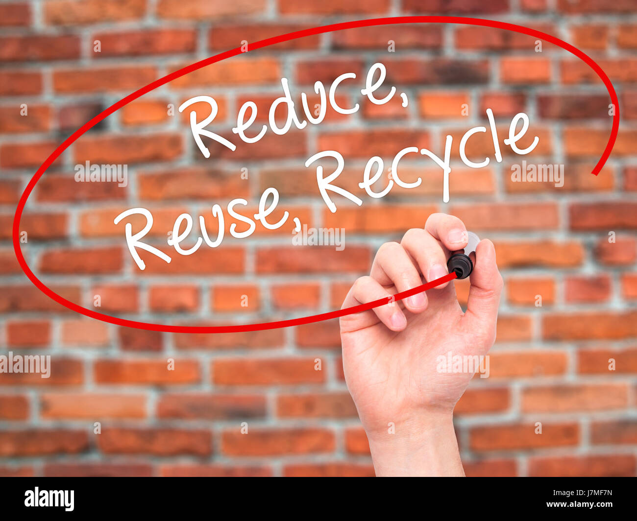 Man Hand writing Reduce Reuse Recycle with black marker on visual ...