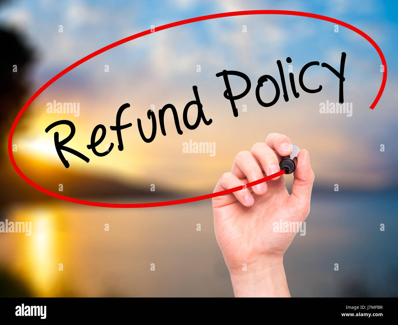 Man Hand writing Refund Policy with black marker on visual screen ...