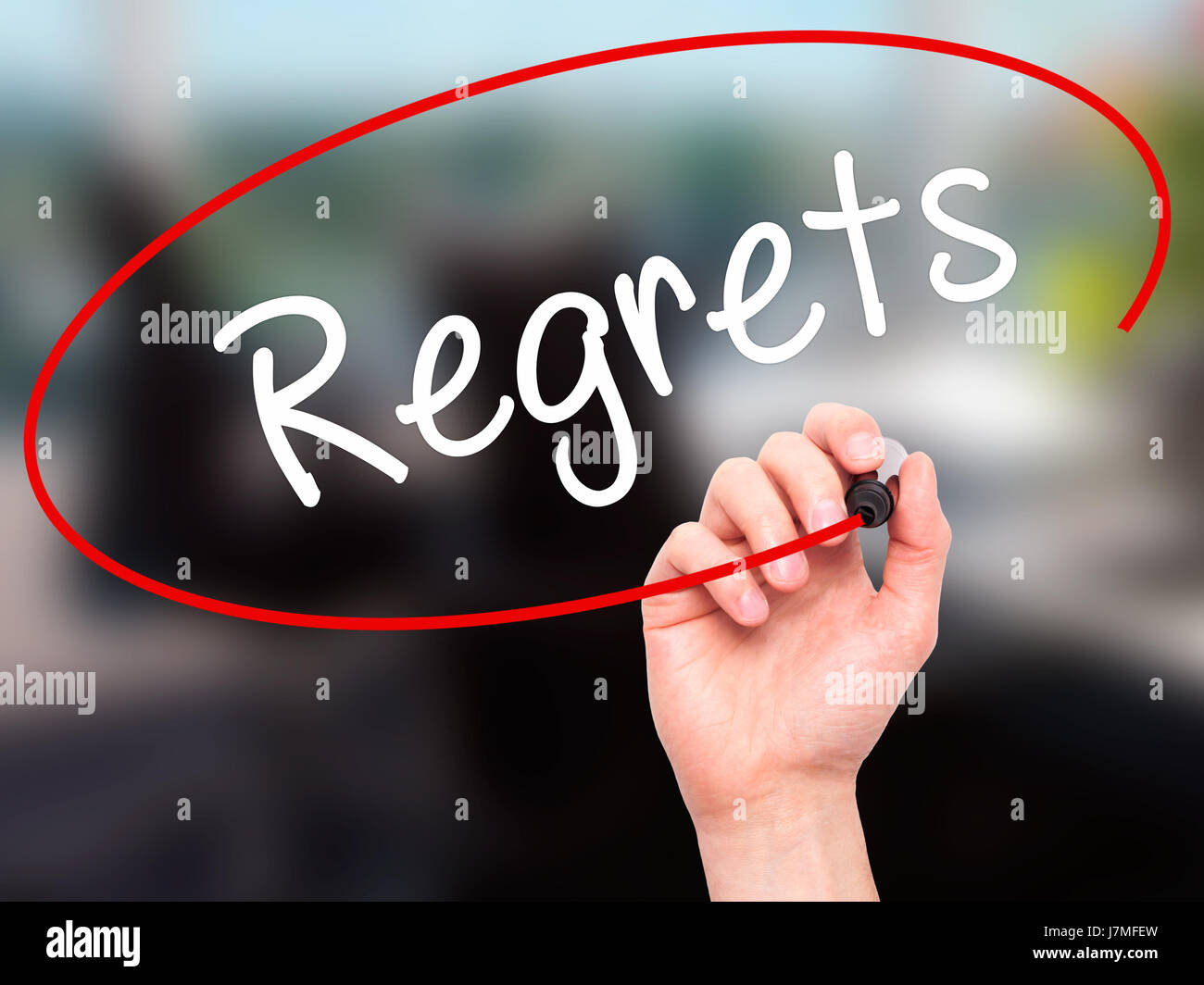Man Hand writing Regrets with black marker on visual screen. Isolated ...