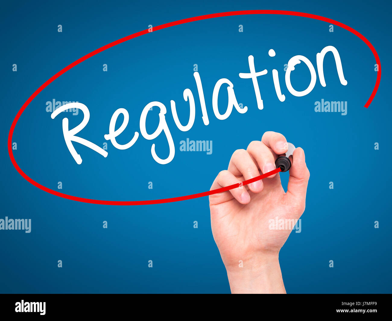 Man Hand writing Regulation with black marker on visual screen ...