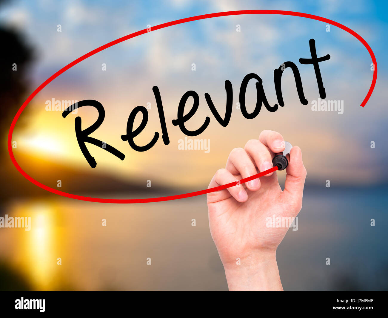 Man Hand writing Relevant with black marker on visual screen. Isolated ...