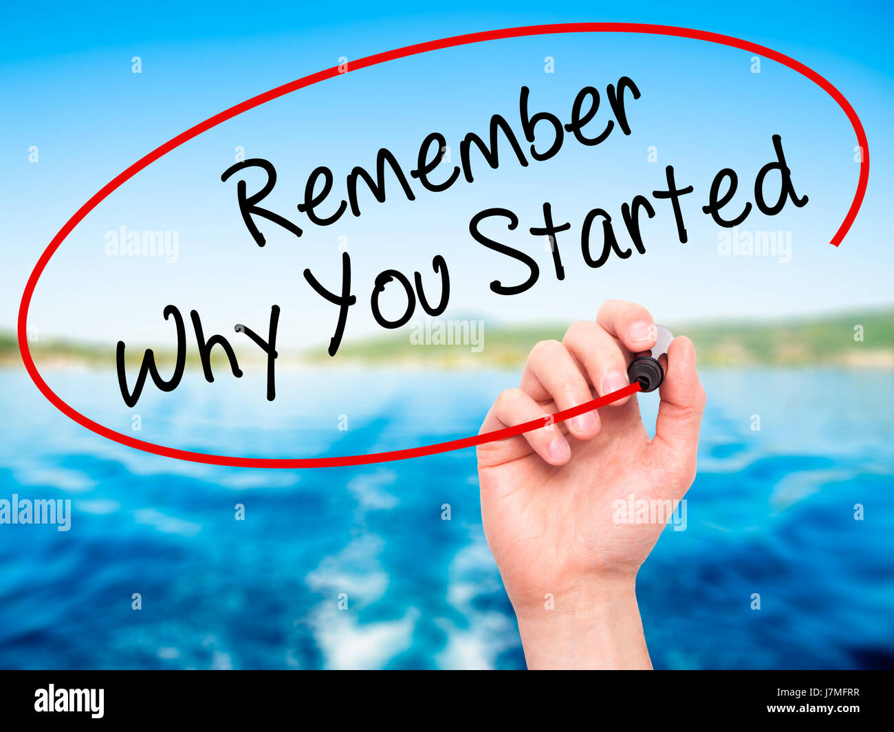 Man Hand writing Remember Why You Started with black marker on visual ...
