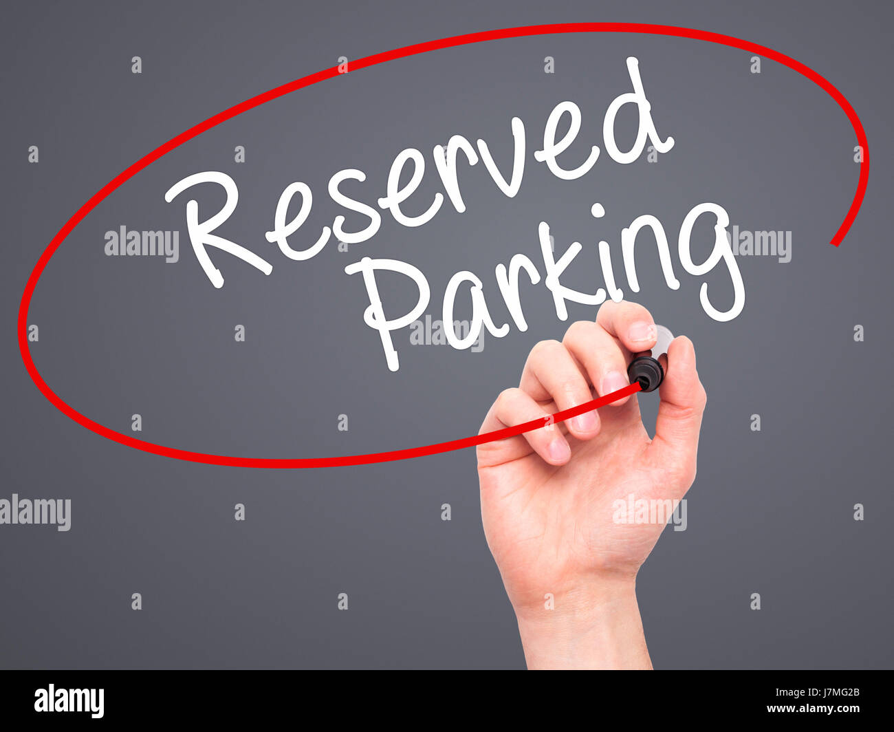 Man Hand writing Reserved Parking with black marker on visual screen ...