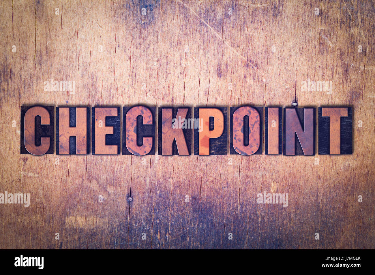 The word Checkpoint concept and theme written in vintage wooden ...