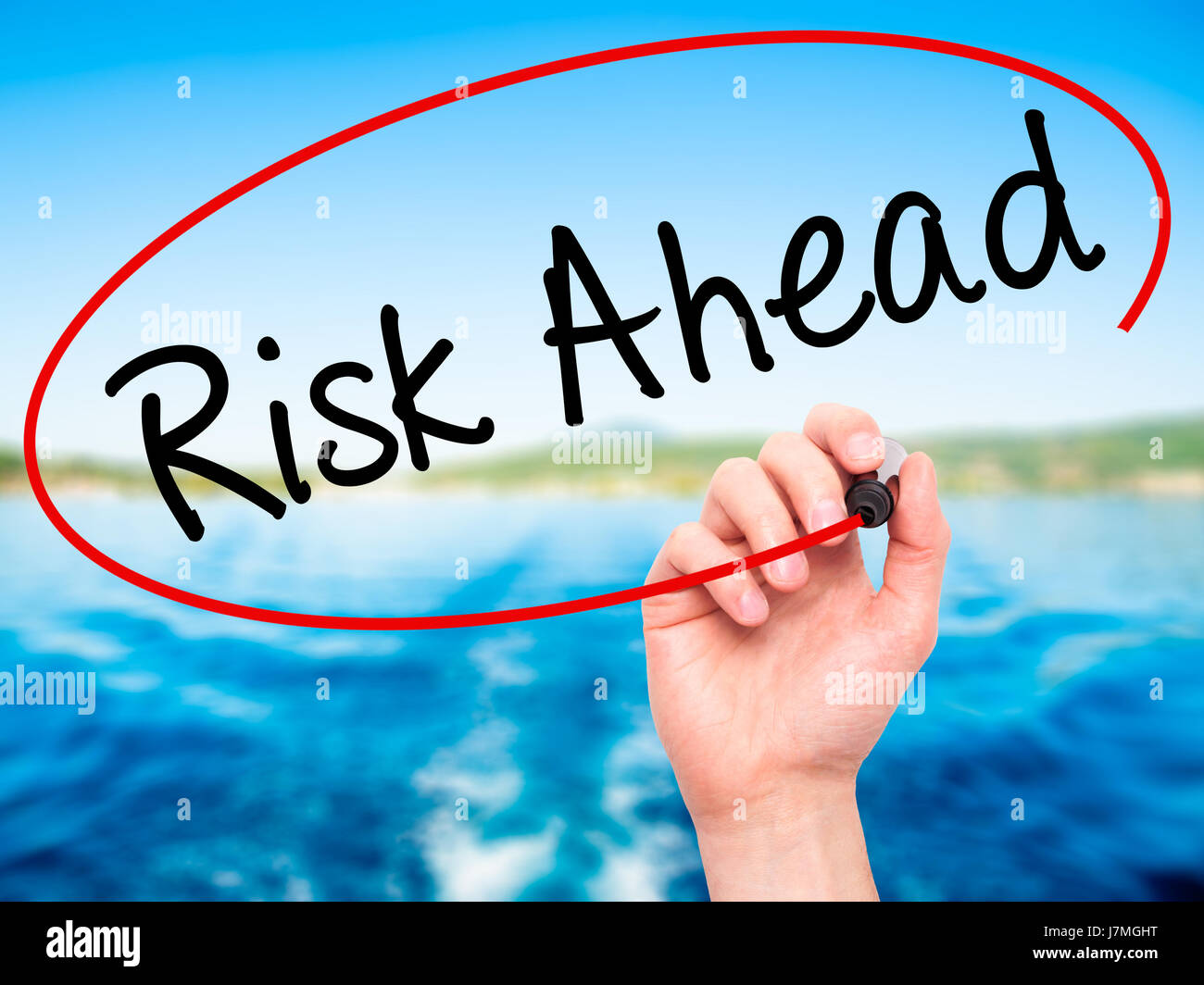 Man Hand writing Risk Ahead with black marker on visual screen ...