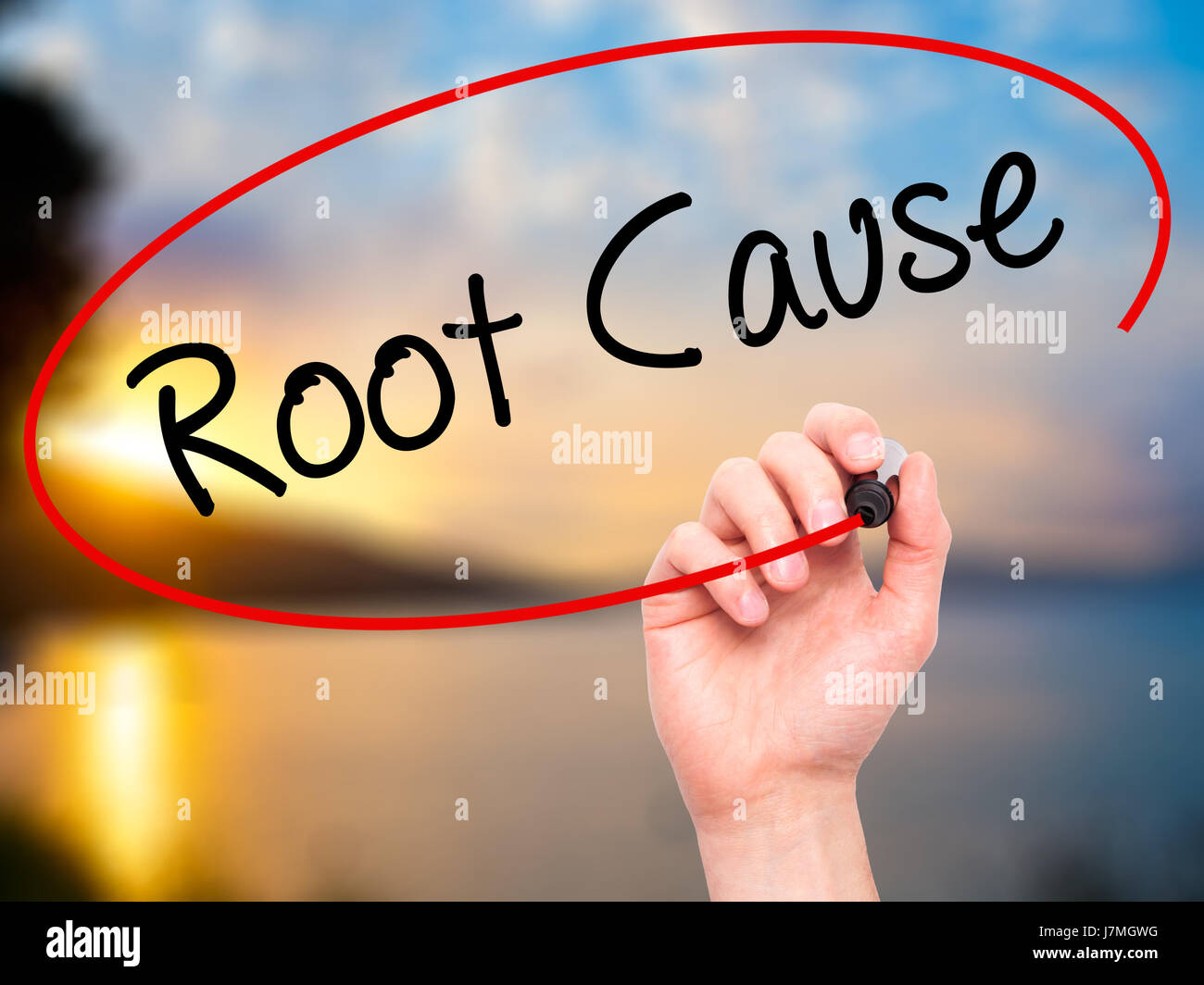 Man Hand writing Root Cause with black marker on visual screen ...