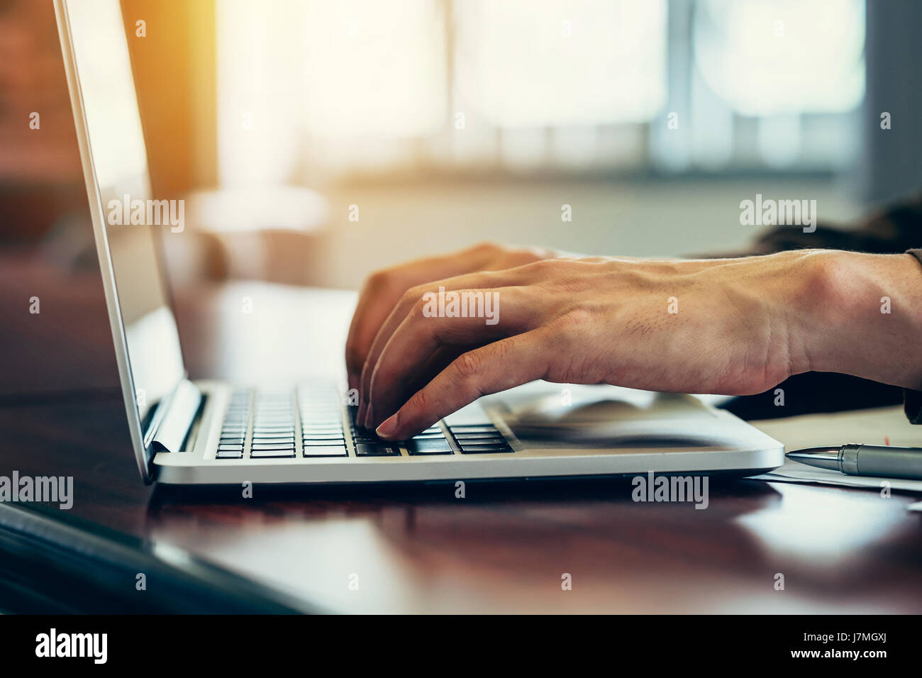 Close up business man hand using computer laptop in the office with ...