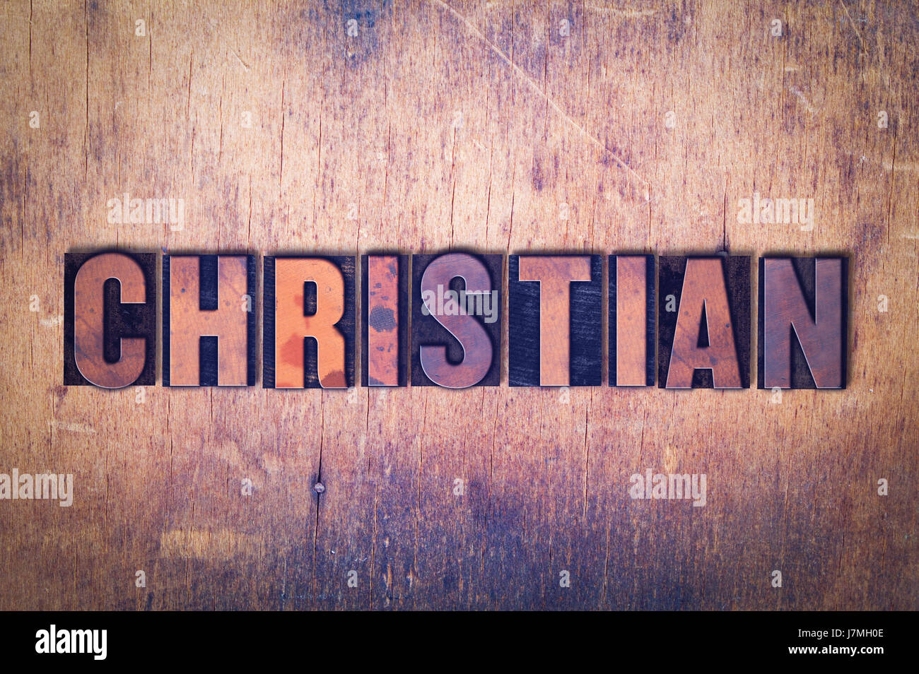 The word Christian concept and theme written in vintage wooden ...